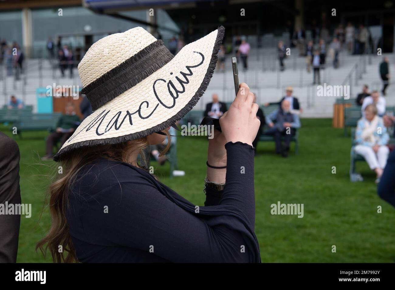 Ascot, Berkshire, UK. 6th May, 2022. A lady wears a large Marc Cain ...