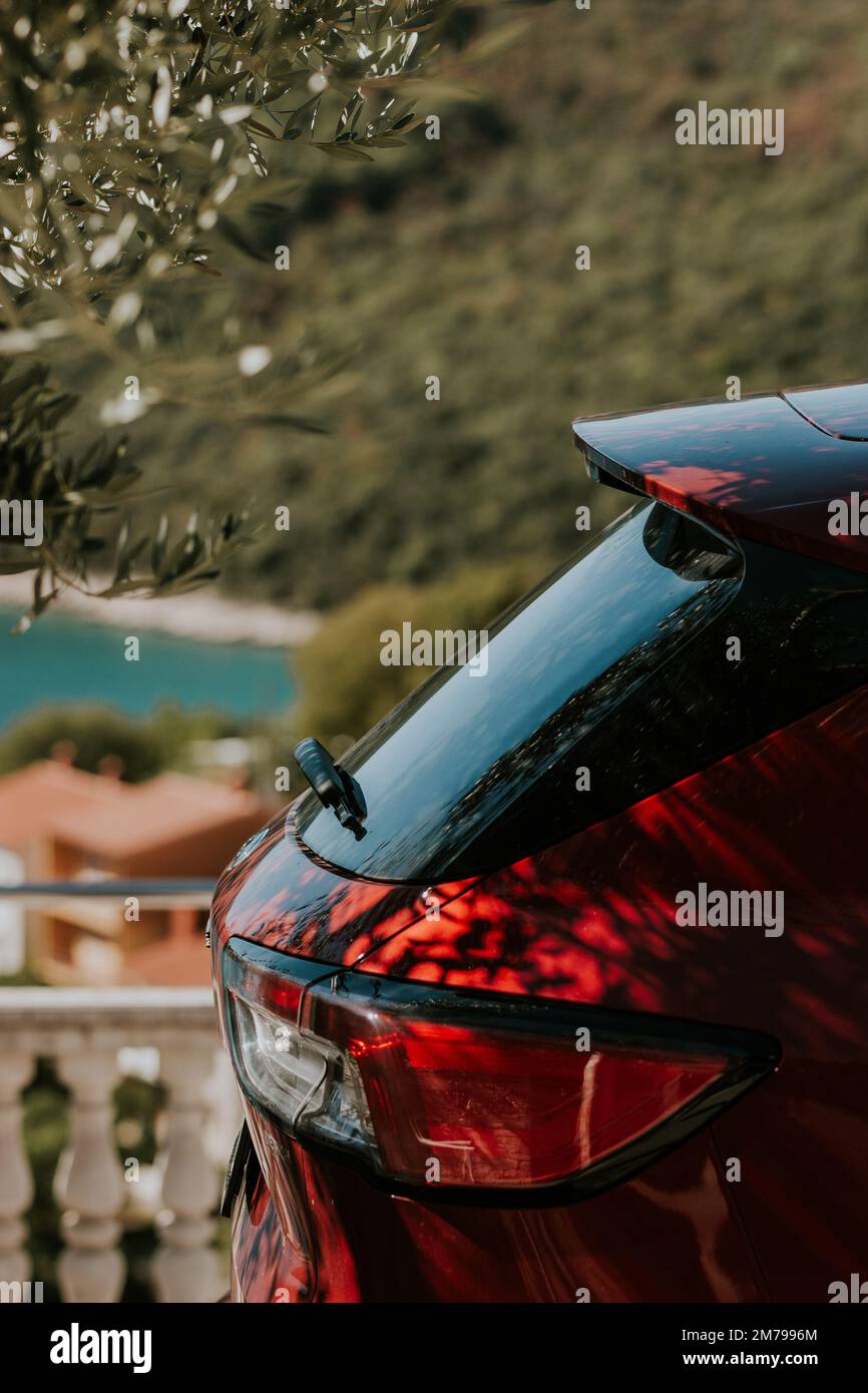 Beautiful red car in the summer Stock Photo - Alamy
