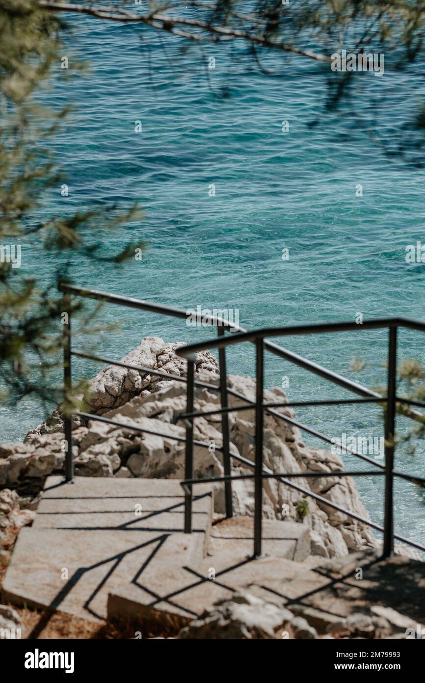 Summer coastline near an island on the deep blue ocean Stock Photo - Alamy