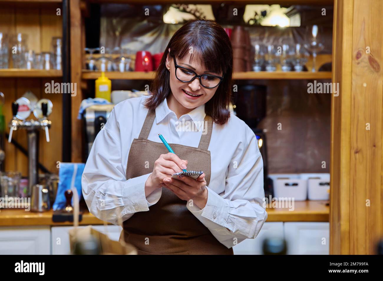 Woman waitress server writing order hi-res stock photography and images ...