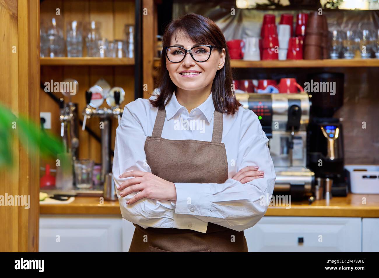 Portrait of middle aged confident woman restaurant owner Stock Photo ...