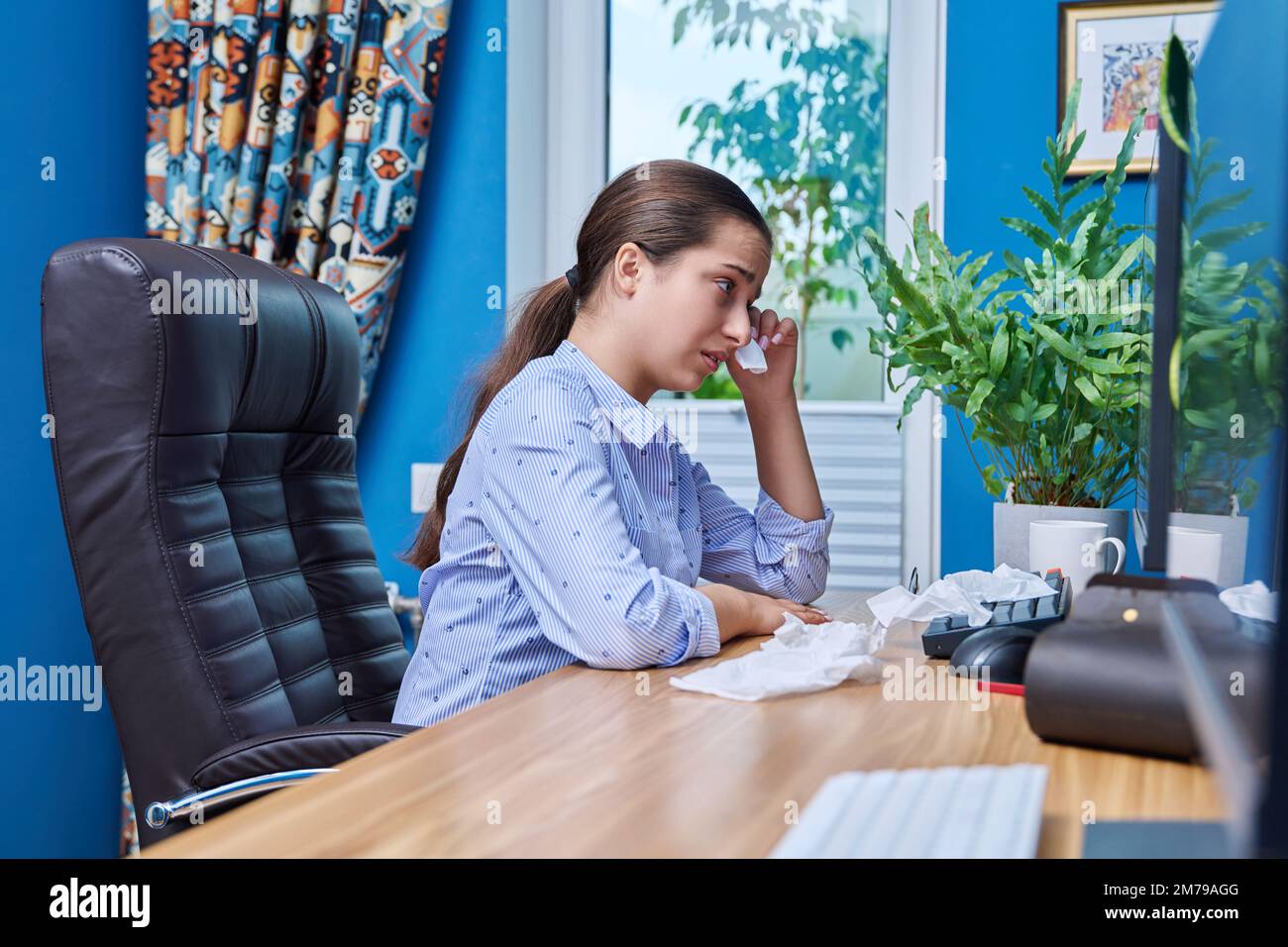Teenage upset girl crying in front of computer screen Stock Photo - Alamy