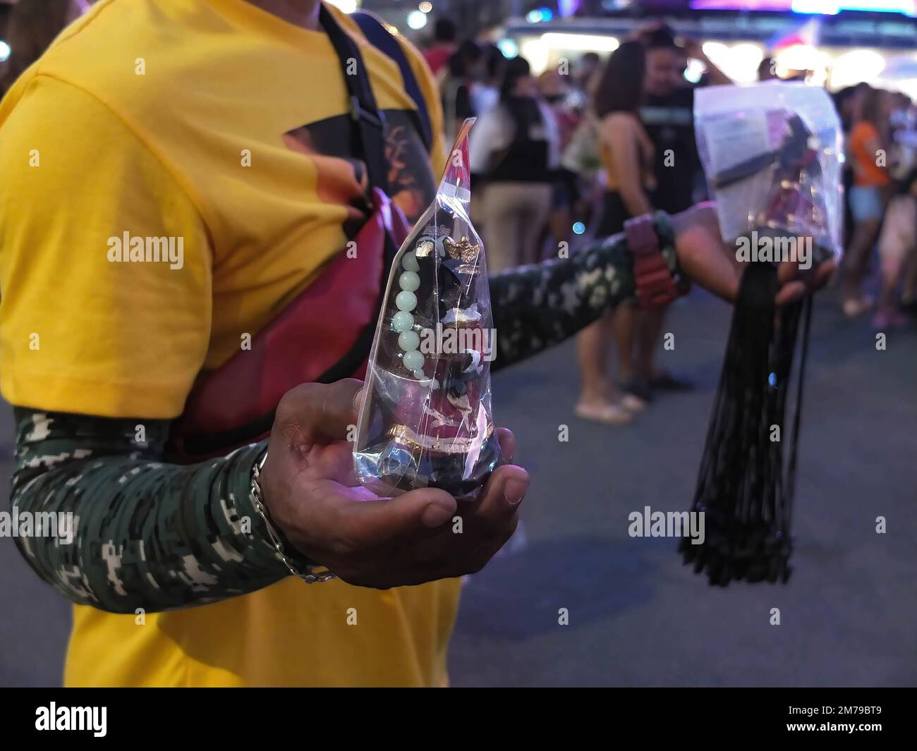 A vendor seen peddling his merchandise, a miniature replica of the ...