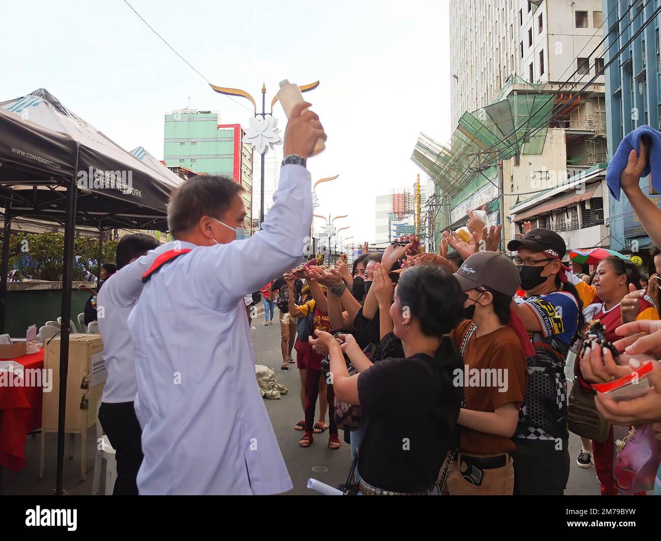 Manila, Philippines. 08th Jan, 2023. Nazarene devotees raise their ...