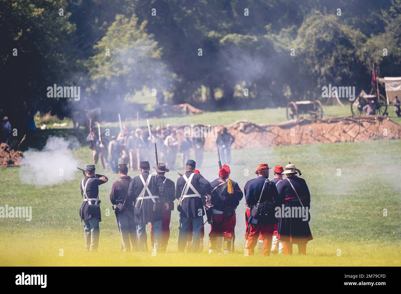 A shallow focus back view of soldiers at Civil War Muster reenactment ...