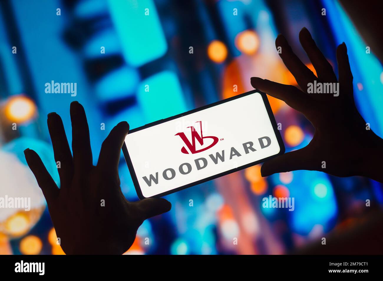 In this photo illustration, the Woodward logo is displayed on a ...