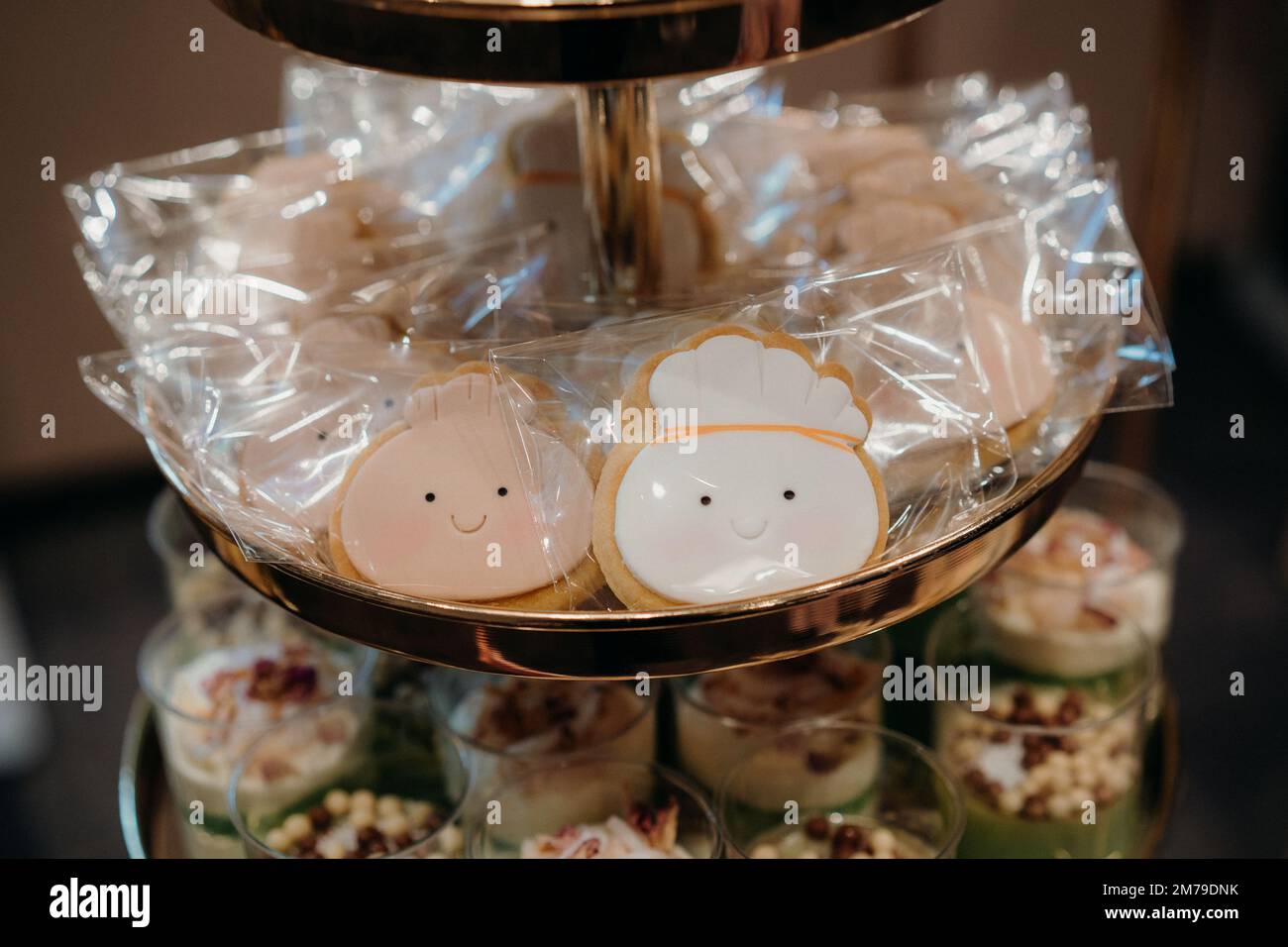 The cute cookies wrapped in white bags for fourchette table Stock Photo ...