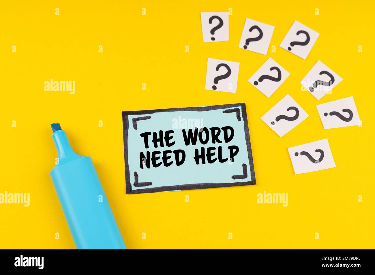 Business concept. On the yellow surface lies a blue marker, question ...