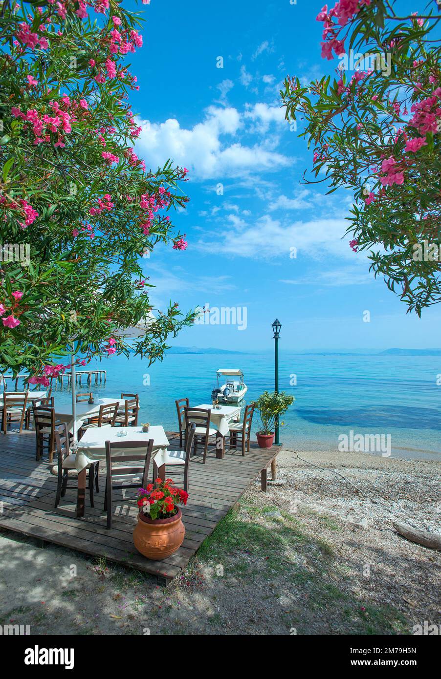 Taverna tables on beachfront, Boukari, Corfu, Ioanian islands, Greece ...