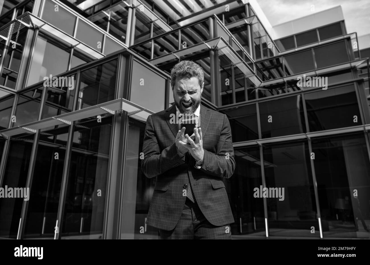 communication. shouting businessman hold smartphone. man boss has ...