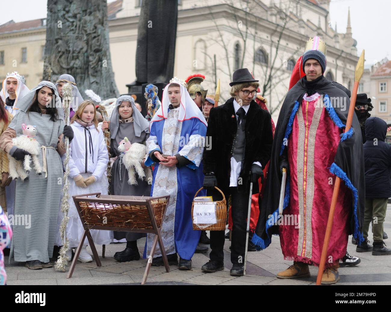People dressed in costumes pose for a photo during the folk folklore ...