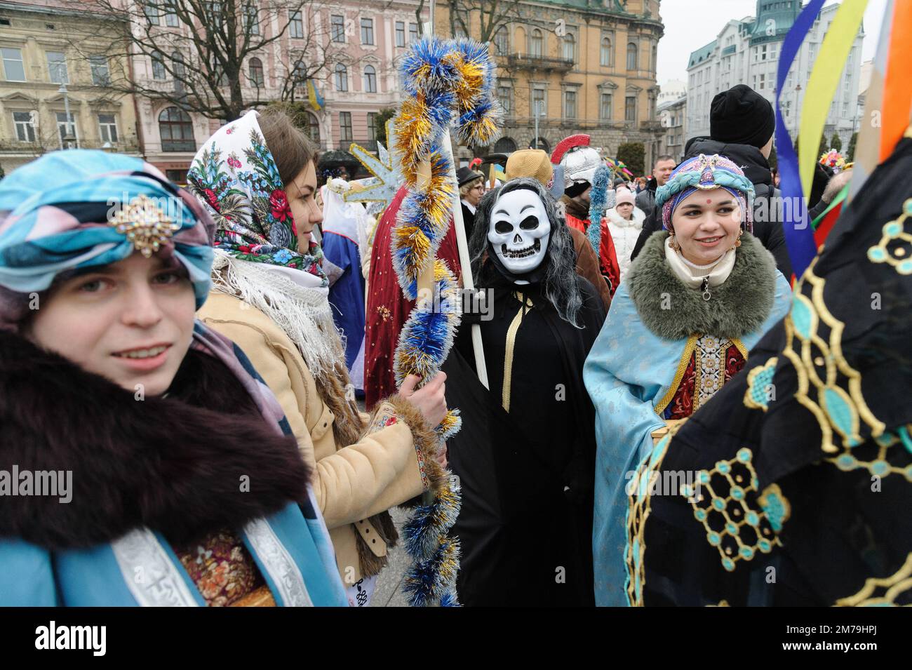 People dressed in costumes pose for a photo during the folk folklore ...