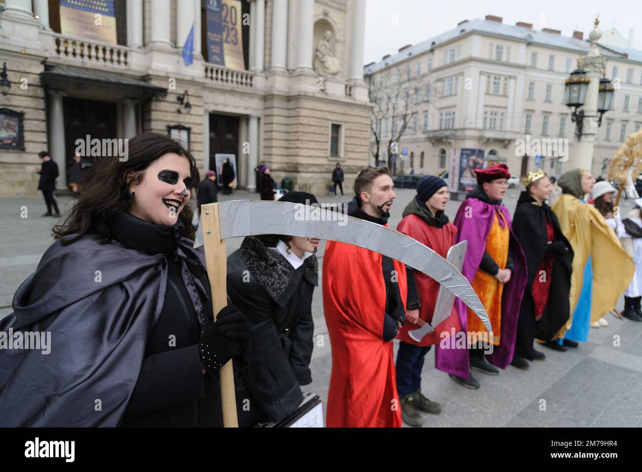 People dressed in costumes pose for a photo during folk folklore ...