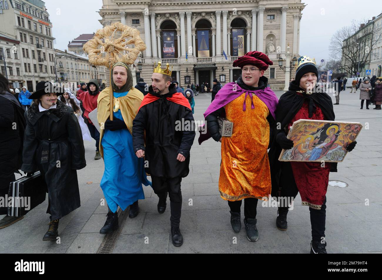 People dressed in costumes pose for a photo during folk folklore ...