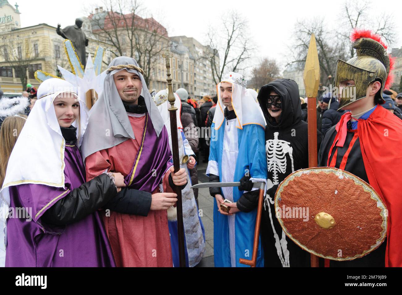 People dressed in costumes pose for a photo during the folk folklore ...