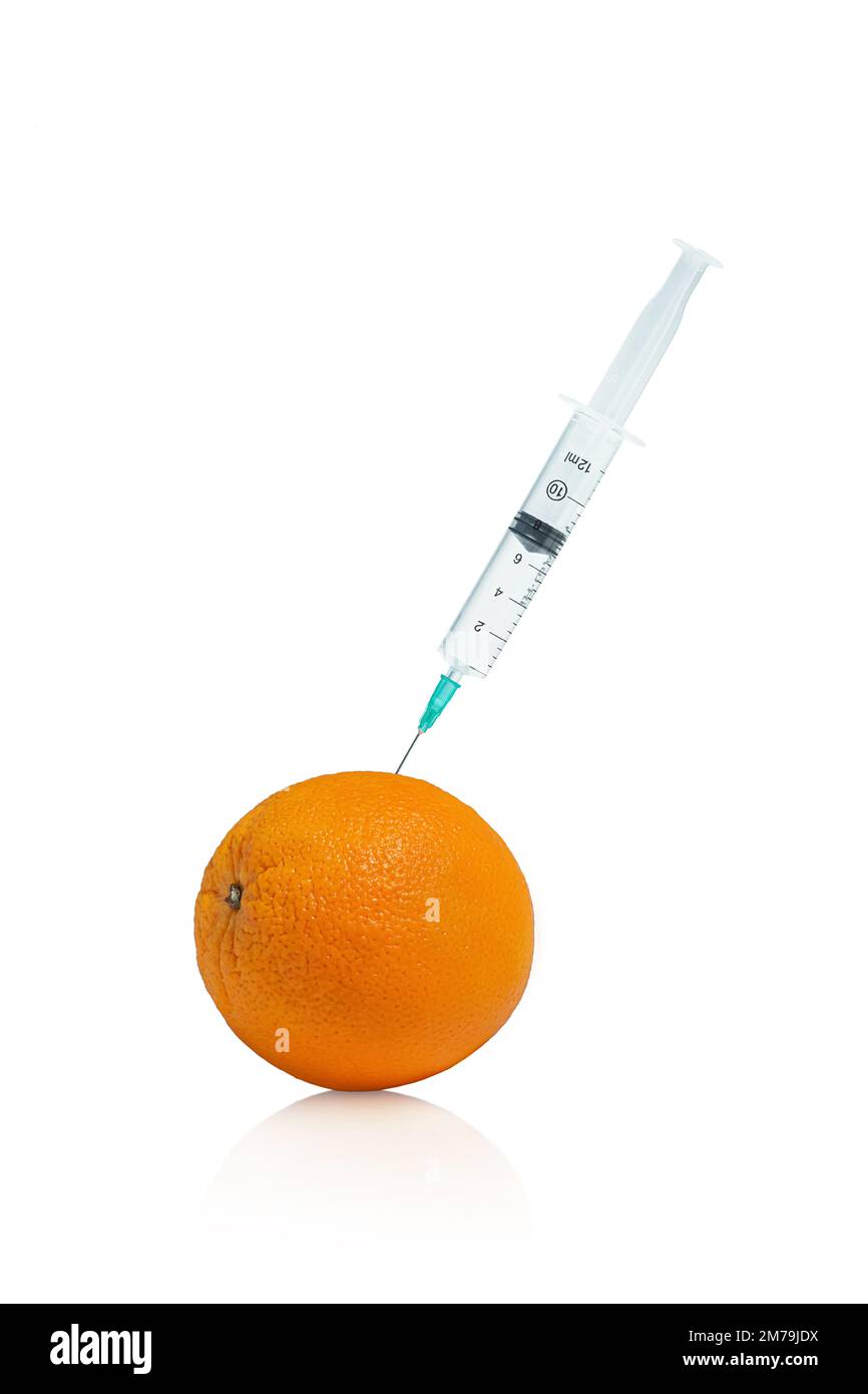 Syringe in orange on white background Stock Photo - Alamy