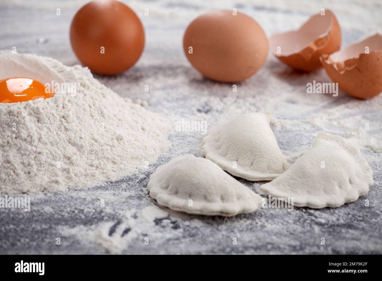 Traditional Polish dumplings. Homemade dumplings production Stock Photo ...