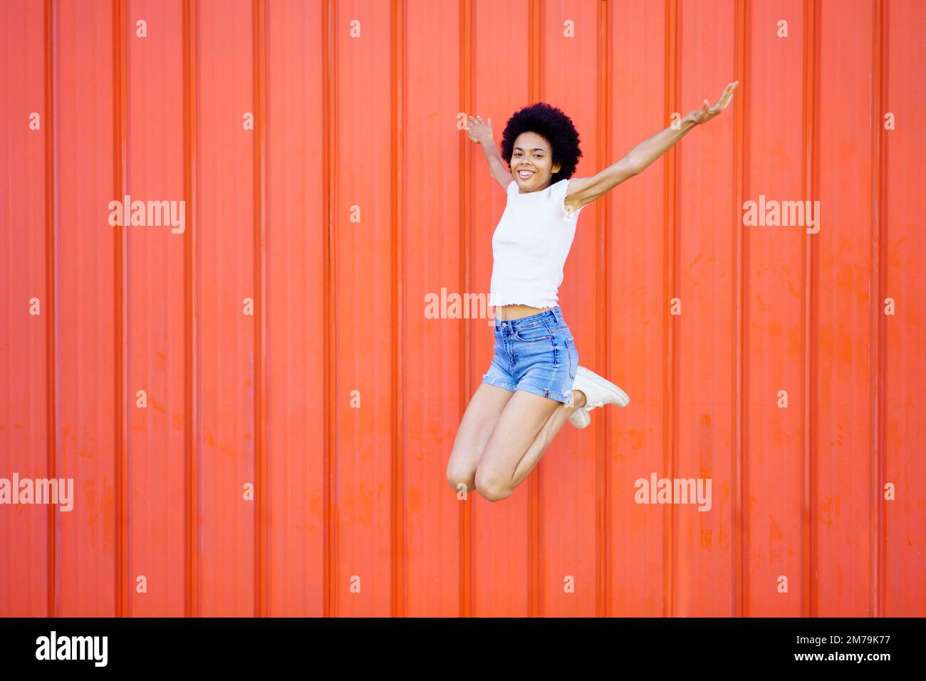 Full body young african woman jump hi-res stock photography and images ...