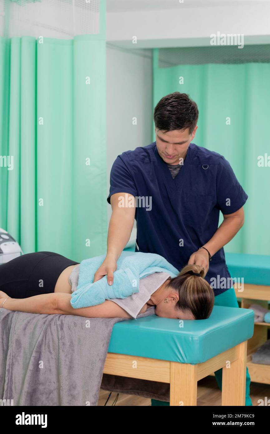Doctor examining back patient hi-res stock photography and images - Alamy