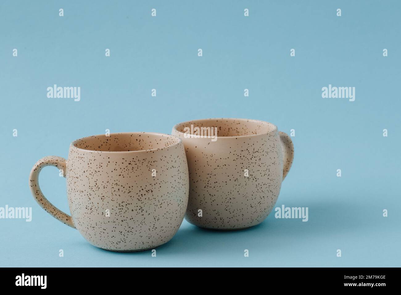 Two porcelain empty cups on a blue background, copy space Stock Photo ...
