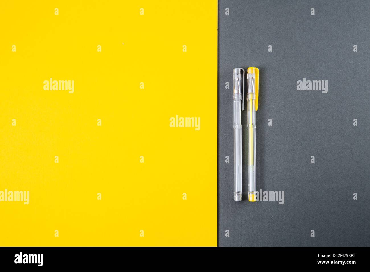 Yellow and gray gel pens on a yellow and gray background Stock Photo ...