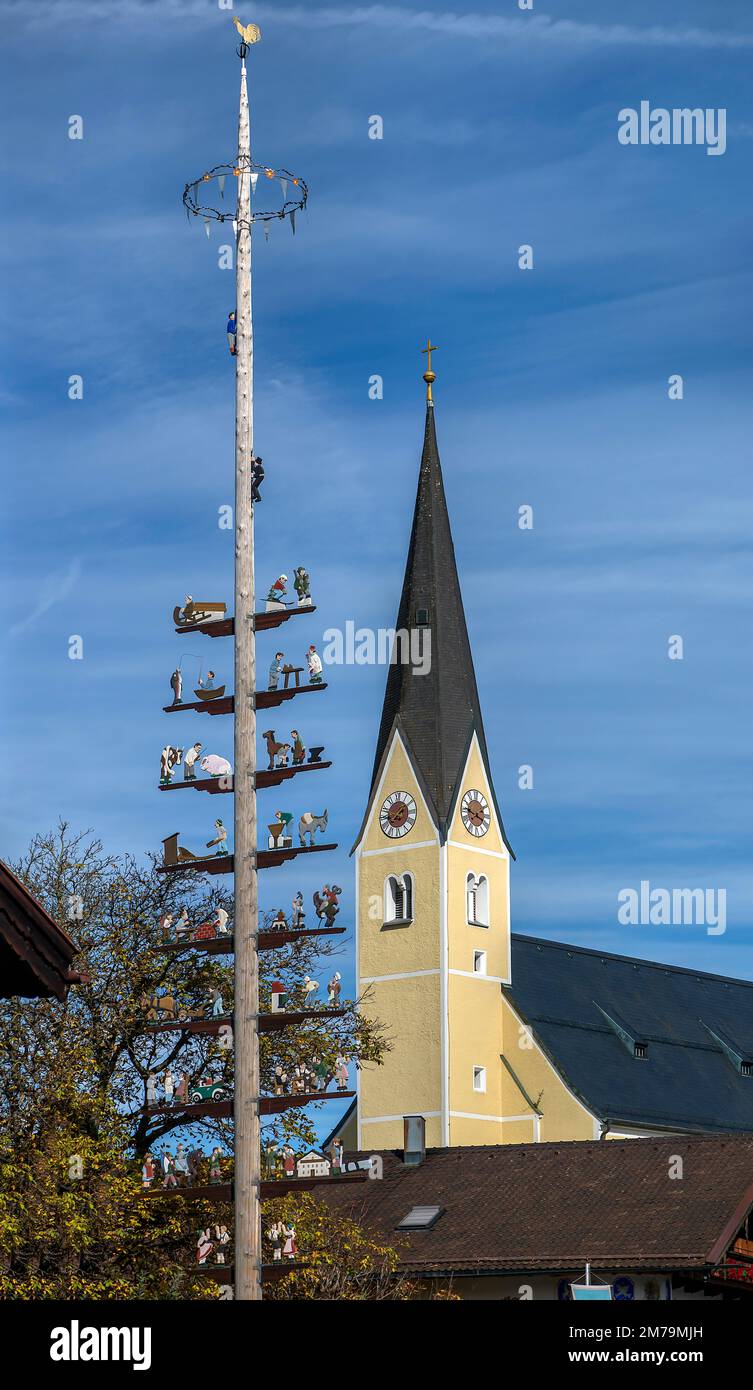 Maypole with the parish church of the Assumption of the Virgin Mary ...