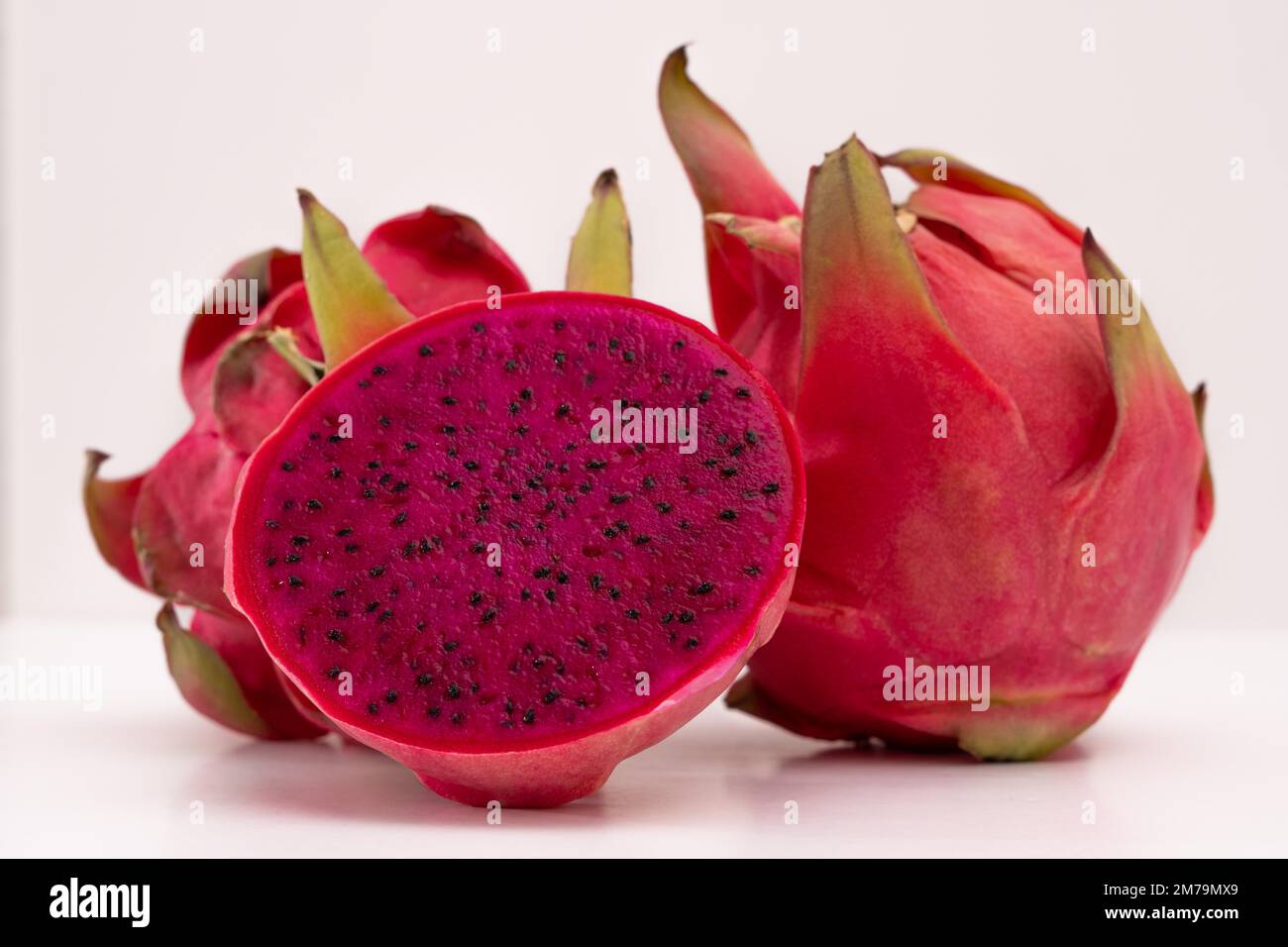 Pink pitahaya or dragon fruit isolated on white background with copy ...