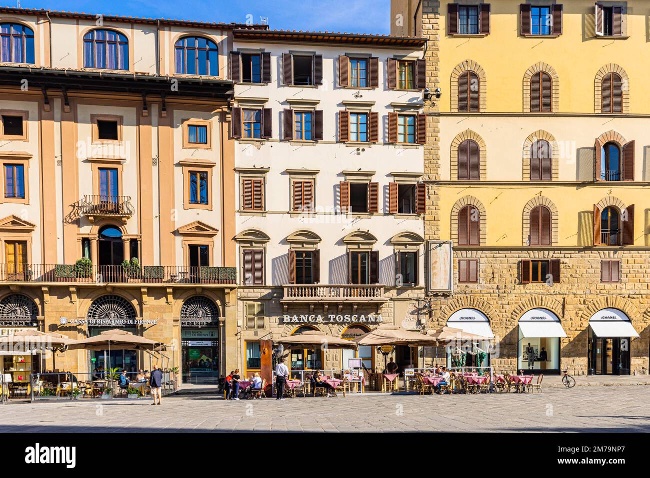 Sidewalk cafes and pastel-coloured house facades at Piazza della ...