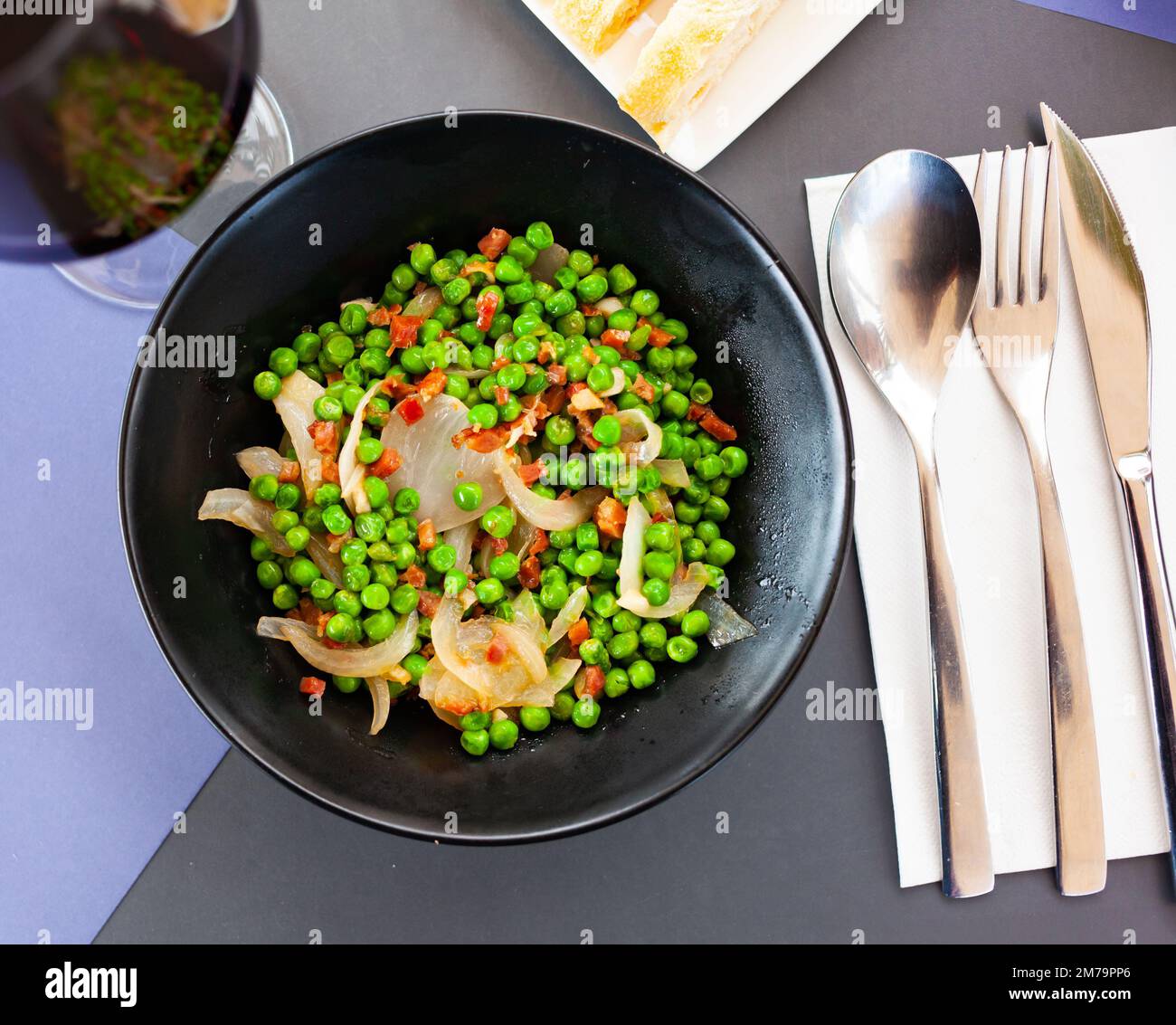 Appetizing dish of peas with ham Stock Photo - Alamy
