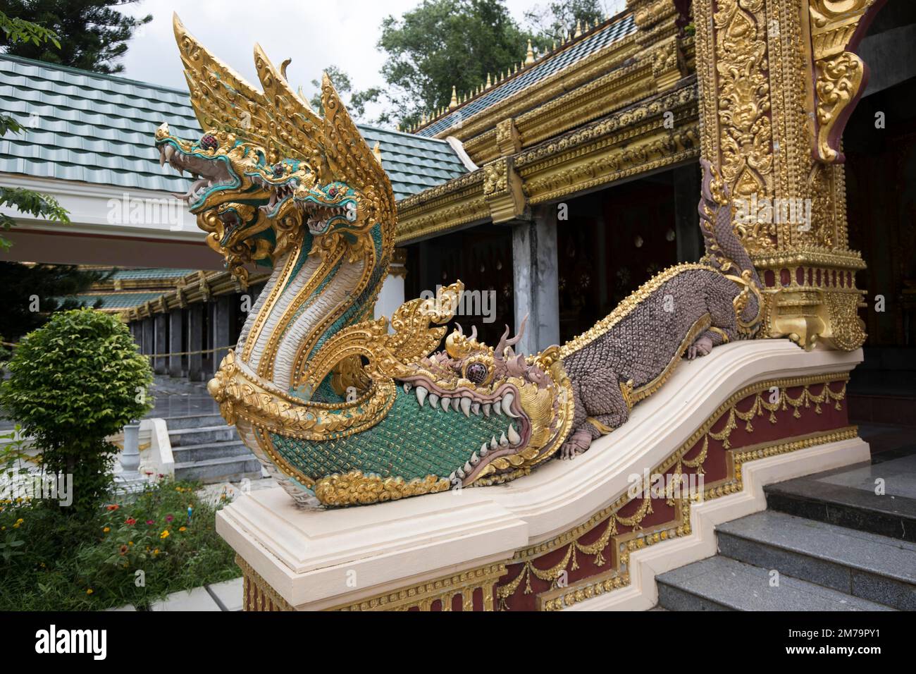 Dragon heads at the entrance of the temple complex Sri Chai Mongkol ...