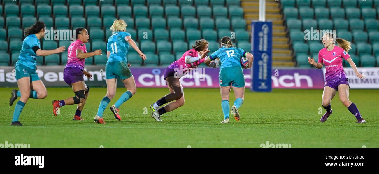 NORTHAMPTON, ENGLAND : Ellie Lennon of Wasps is stop by Helen Nelson of ...