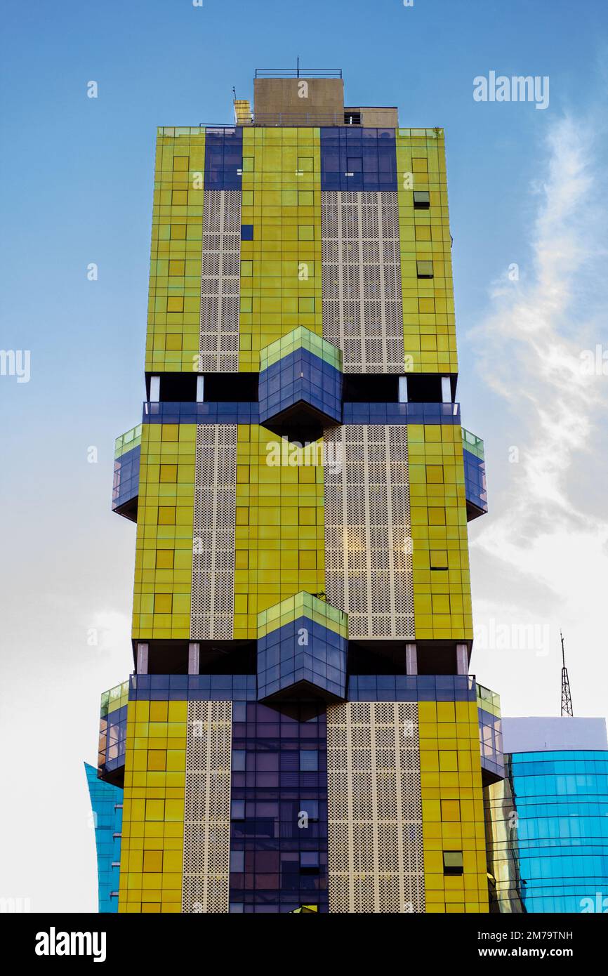 skyscraper with yellow and dark glass windows Stock Photo - Alamy