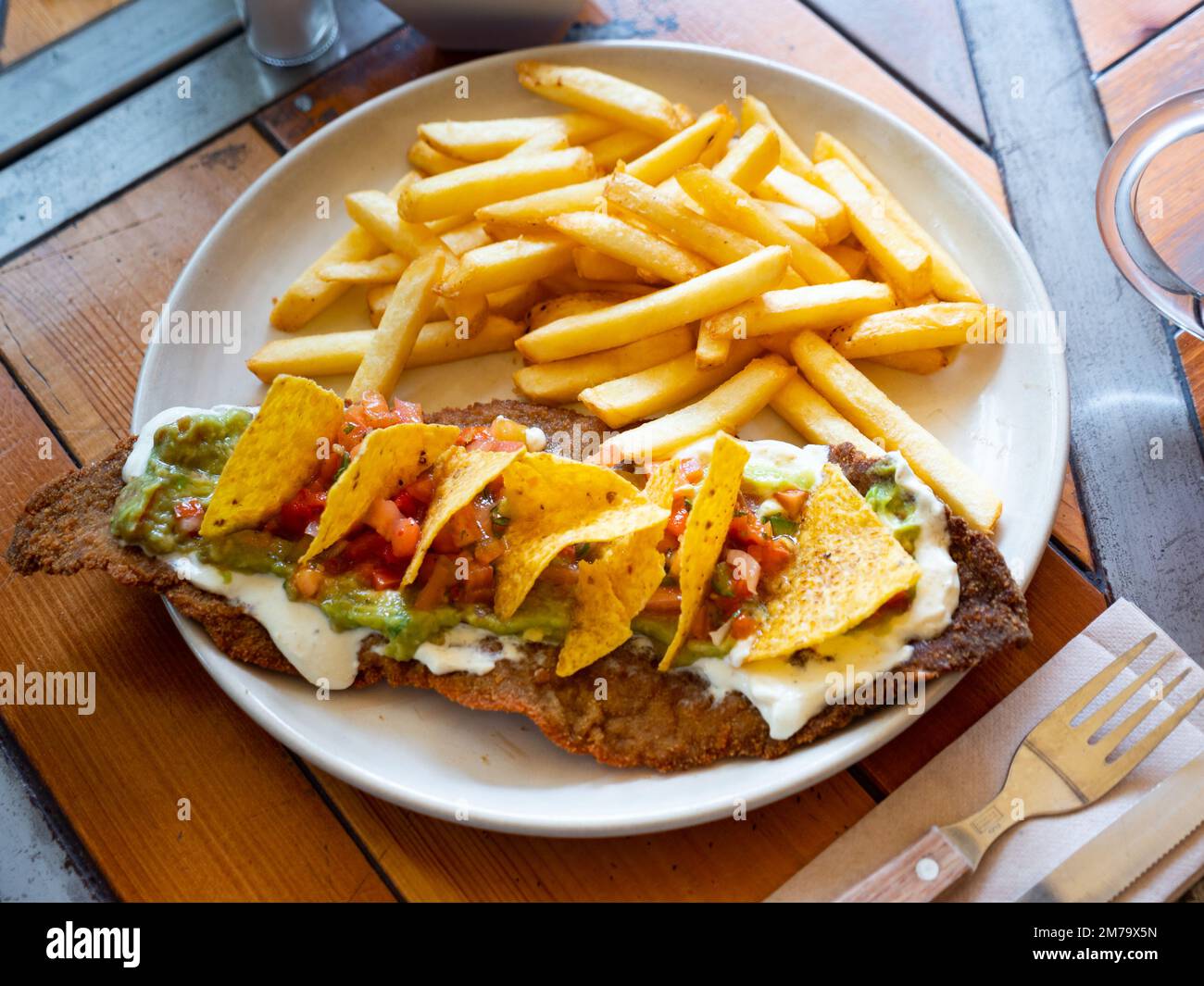 Portion of just cooked Mexican milanesa with french fries Stock Photo ...