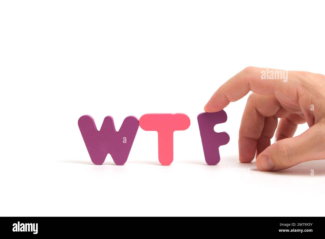 Man hand exposes abbreviation wtf in letters white background Stock ...