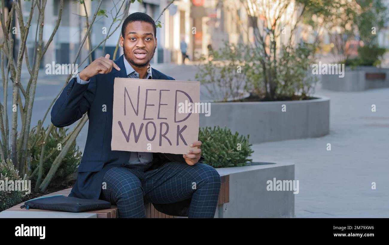 Fired sad dismissed man ethnic guy sitting in city looking for job ...