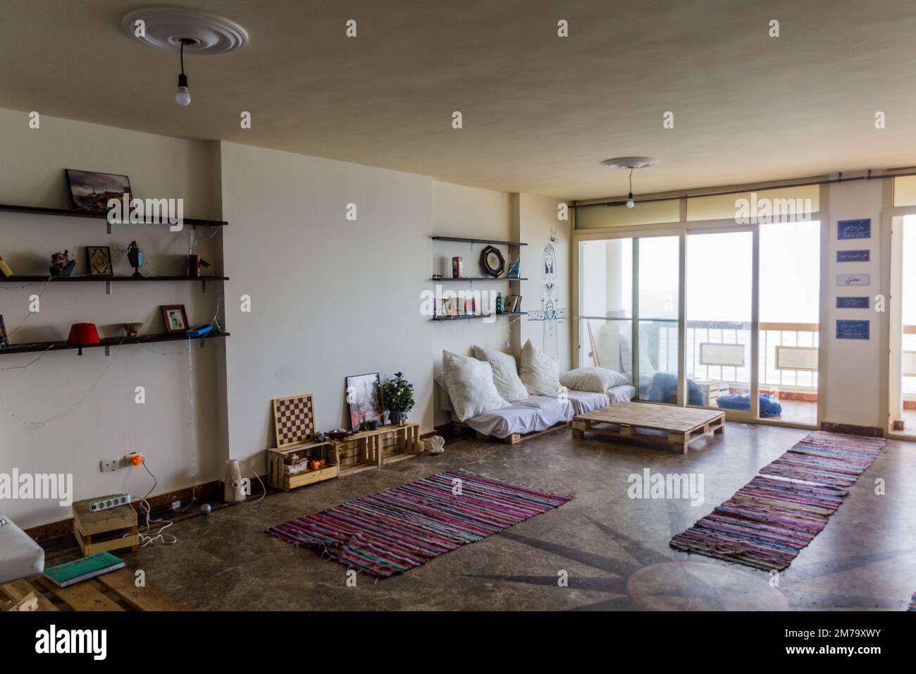 ALEXANDRIA, EGYPT - FEBRUARY 1, 2019: Common room of Ithaka hostel in ...