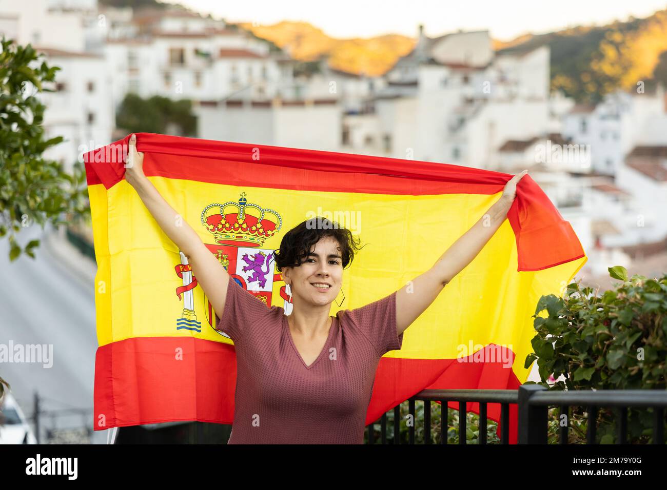 Woman holding spanish flag hi-res stock photography and images - Alamy