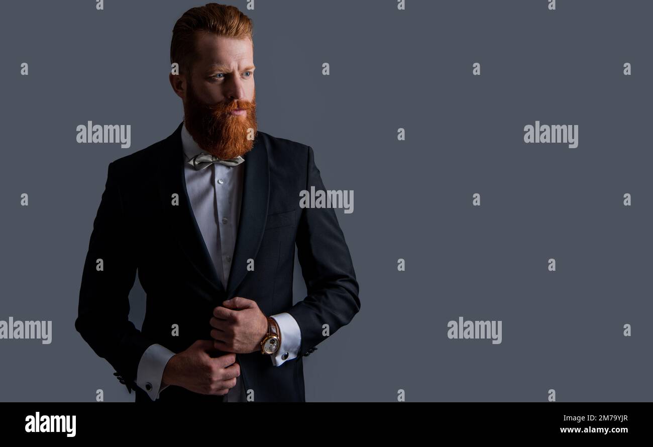 tux fashion. handsome bearded man in tux isolated on grey background ...