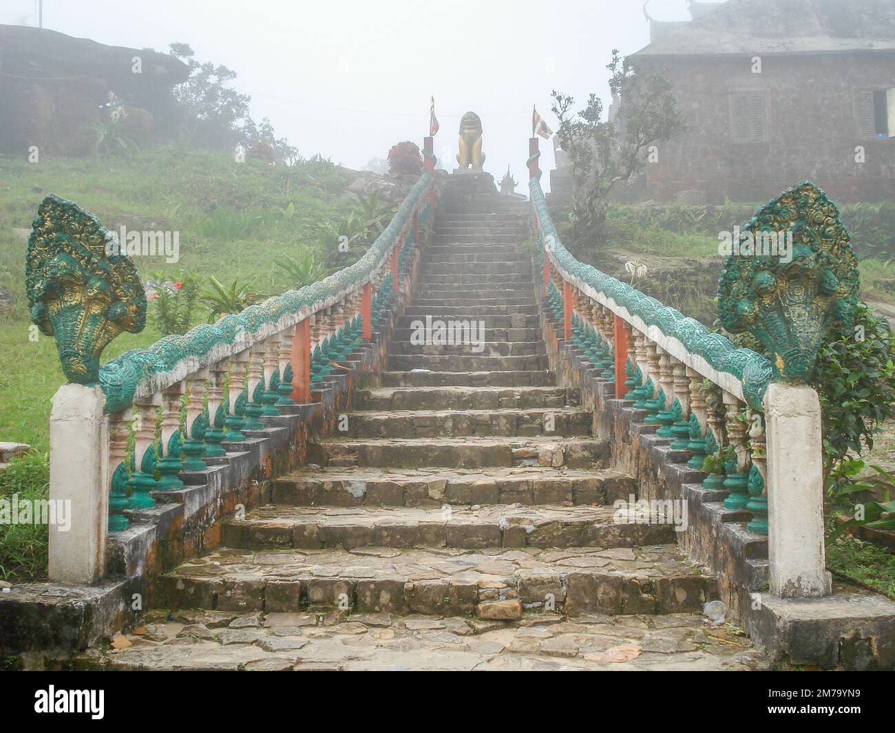 Fog gently covering stairs going to Wat Sampov Pram Temple on top of ...