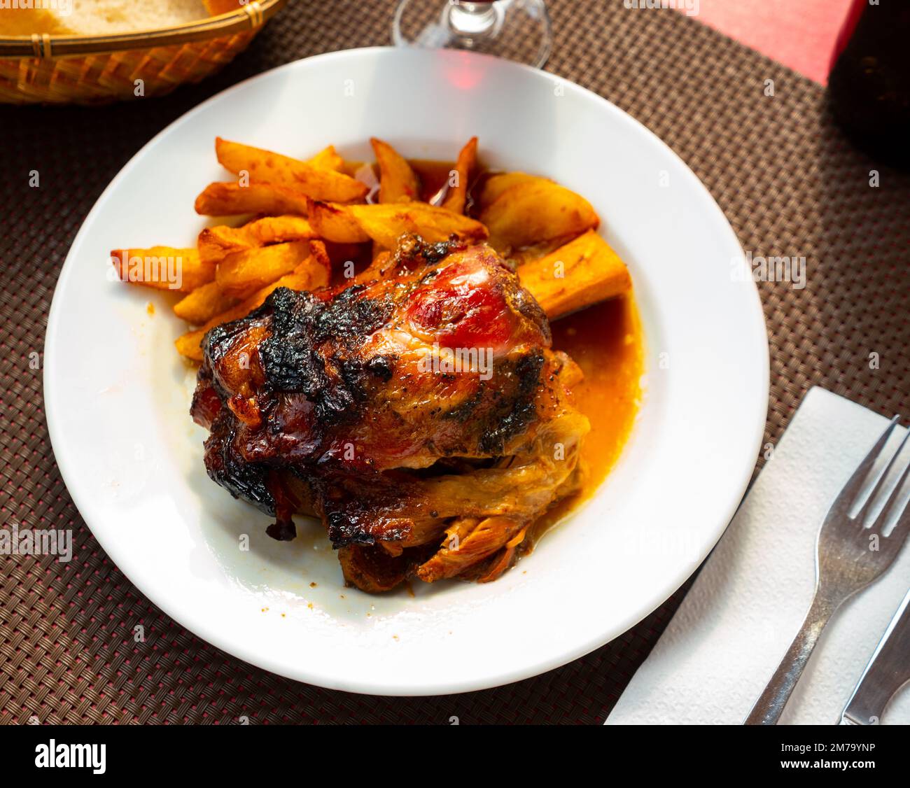 Fried knuckle (codillo rustido) with potatoes Stock Photo - Alamy