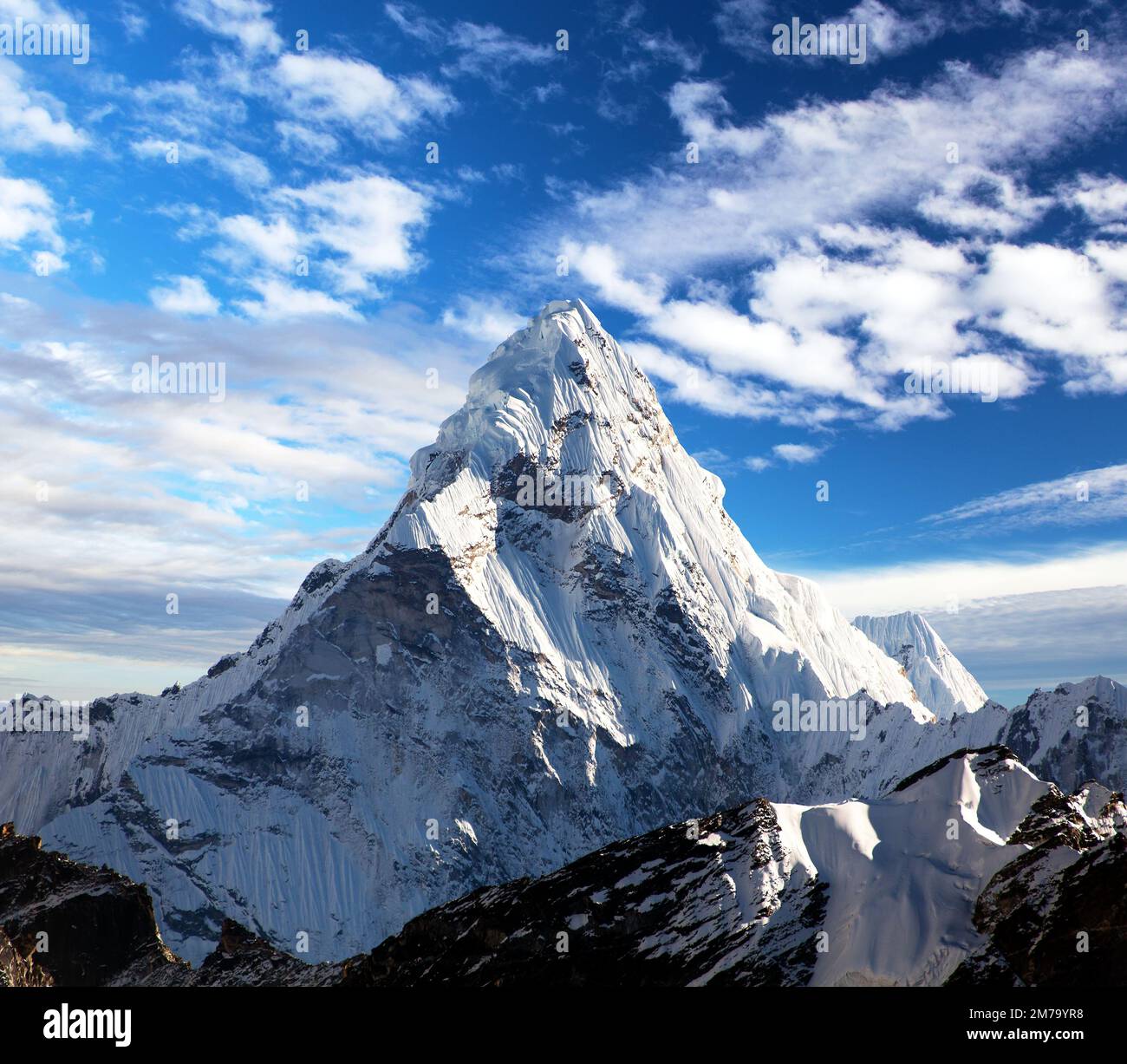 Mount Ama Dablam with beautiful clouds in the sky, way to Mt Everest base camp, Khumbu valley ...