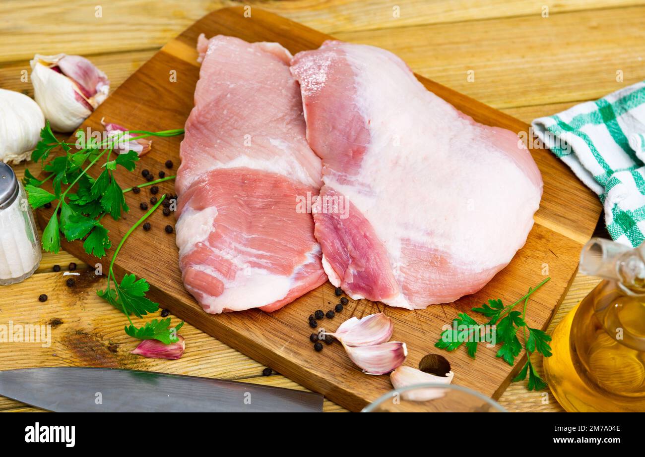 Fresh raw pork secreto fillet (Secreto de cerdo) and condiments ...
