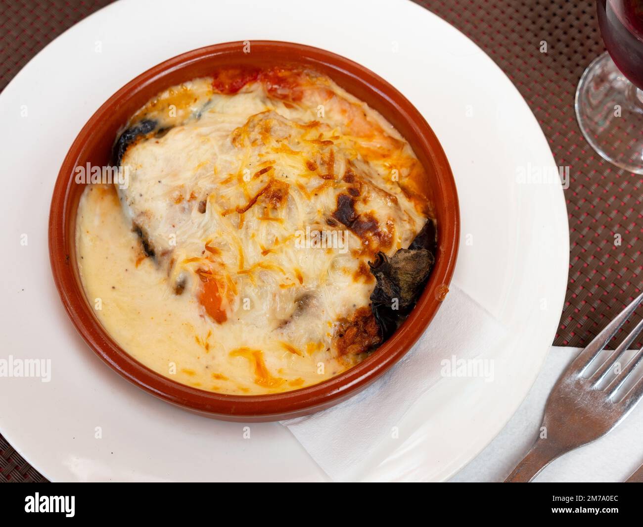 Baked eggplant gratin with cheese and herbs Stock Photo - Alamy
