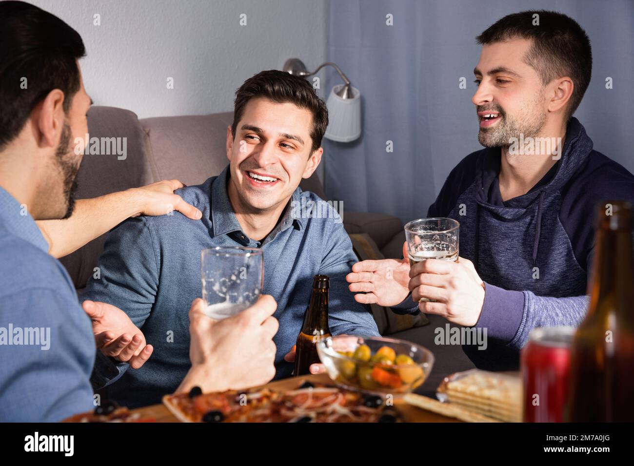 Friendly meeting in men company over beer with pizza Stock Photo - Alamy