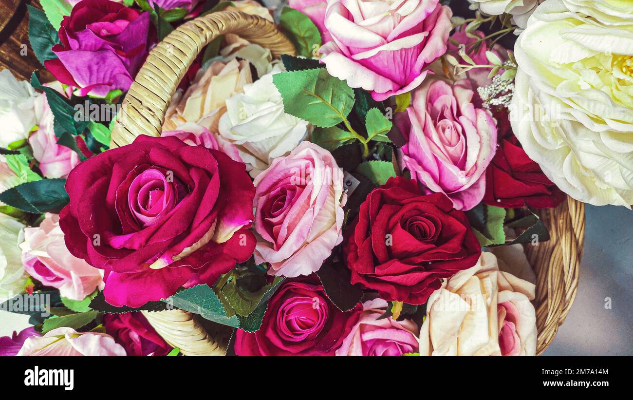 Amazing flower arrangement, roses in basket. Still life Stock Photo - Alamy