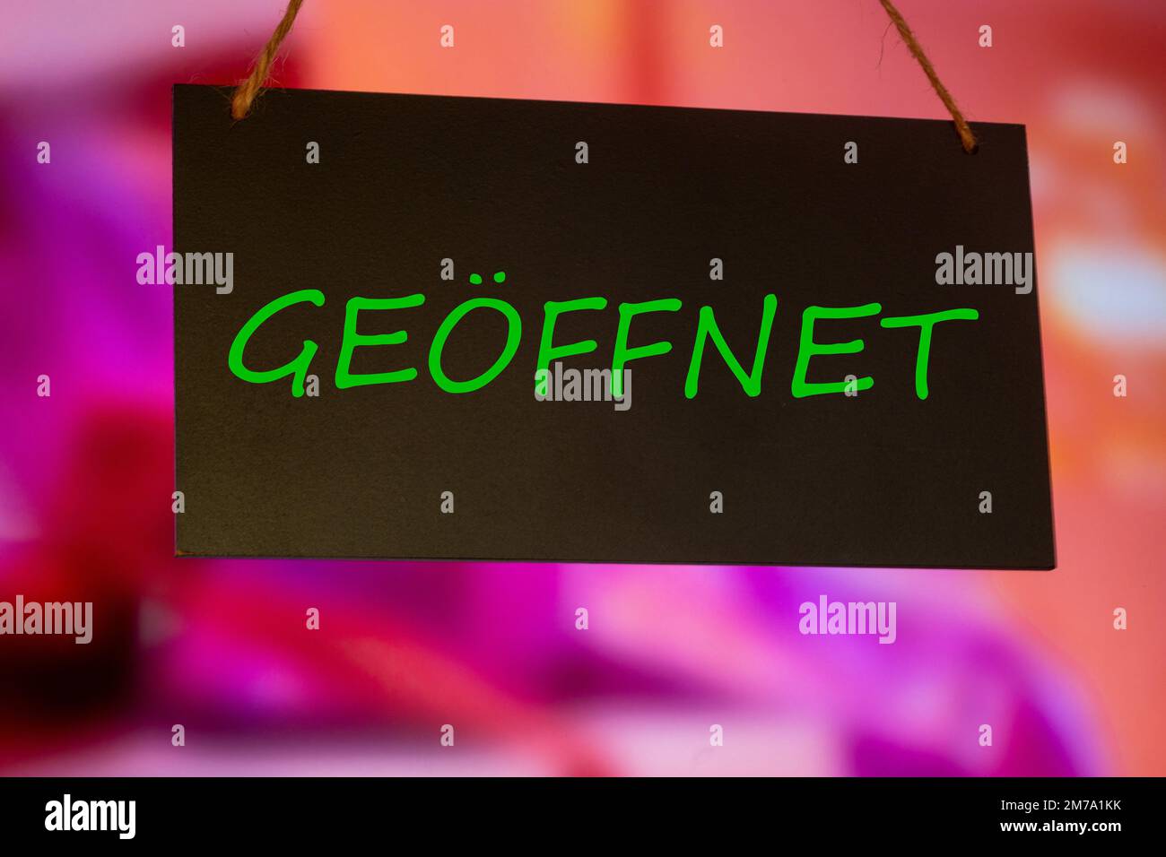 Sign with the notice open on a shop window (Composing Stock Photo - Alamy