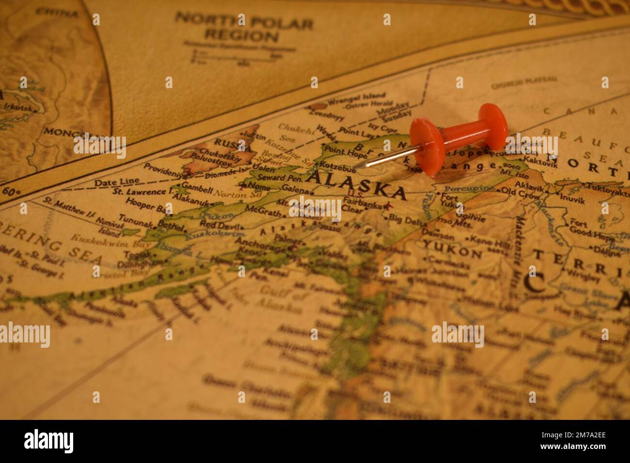 Vintage map of Alaska with a pin on it Stock Photo - Alamy