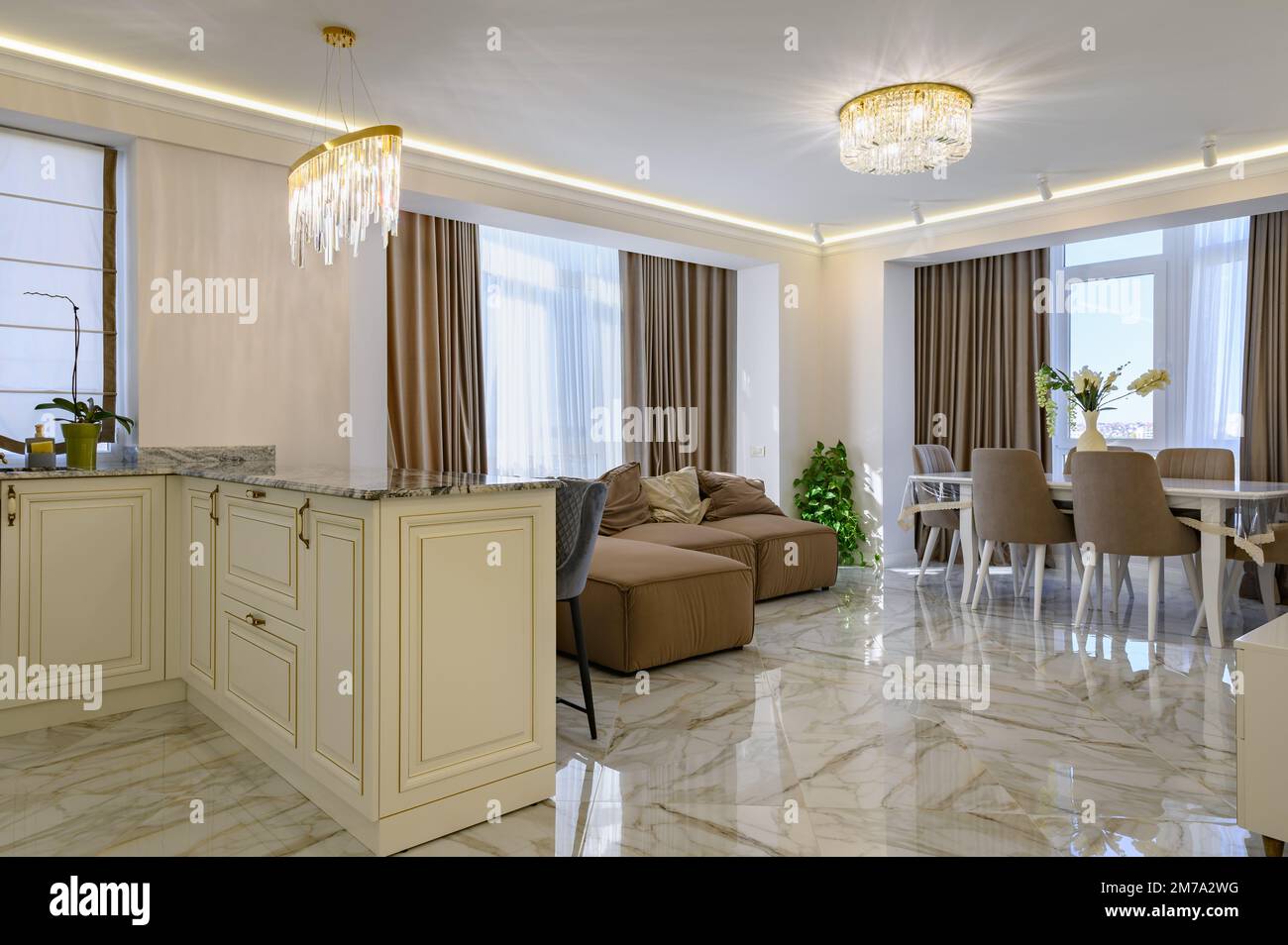 Classic kitchen in creamy color with a spacious and bright design Stock ...