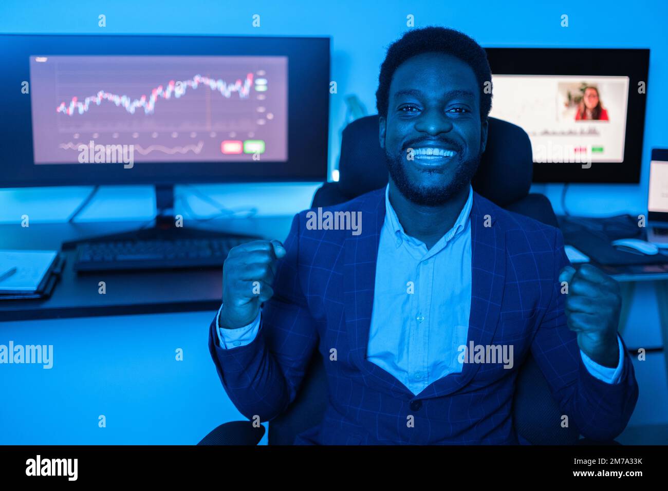 Young successful business man celebrating his profits on his ...