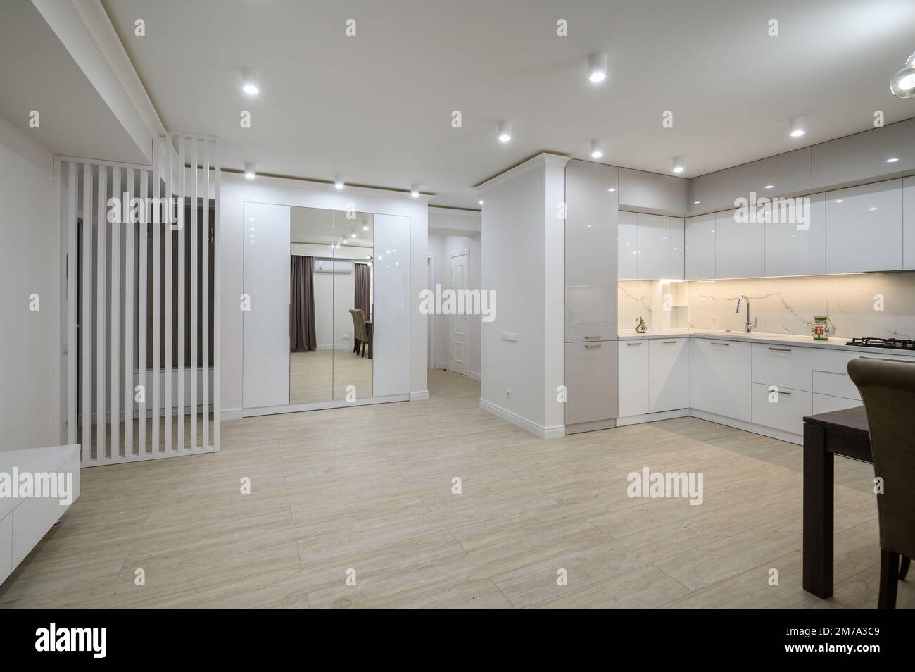 Large white room connected to hall and kitchen in a studio flat Stock ...